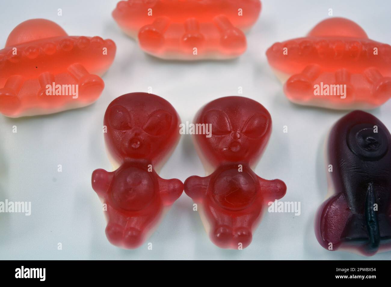 Sweets in the form of red, yellow aliens, cherry space rockets, green ...