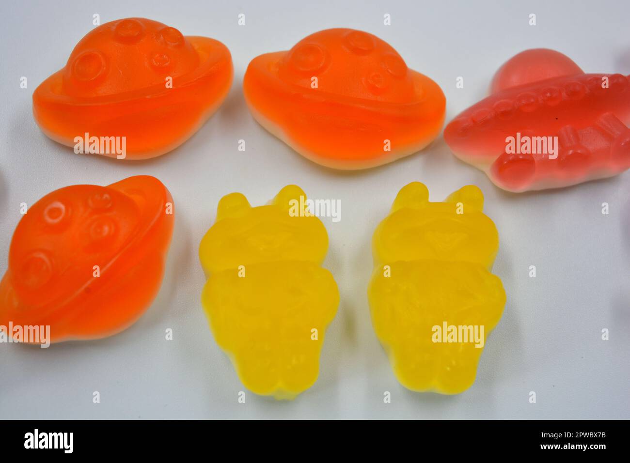 Sweets in the form of red, yellow aliens, cherry space rockets, green ...