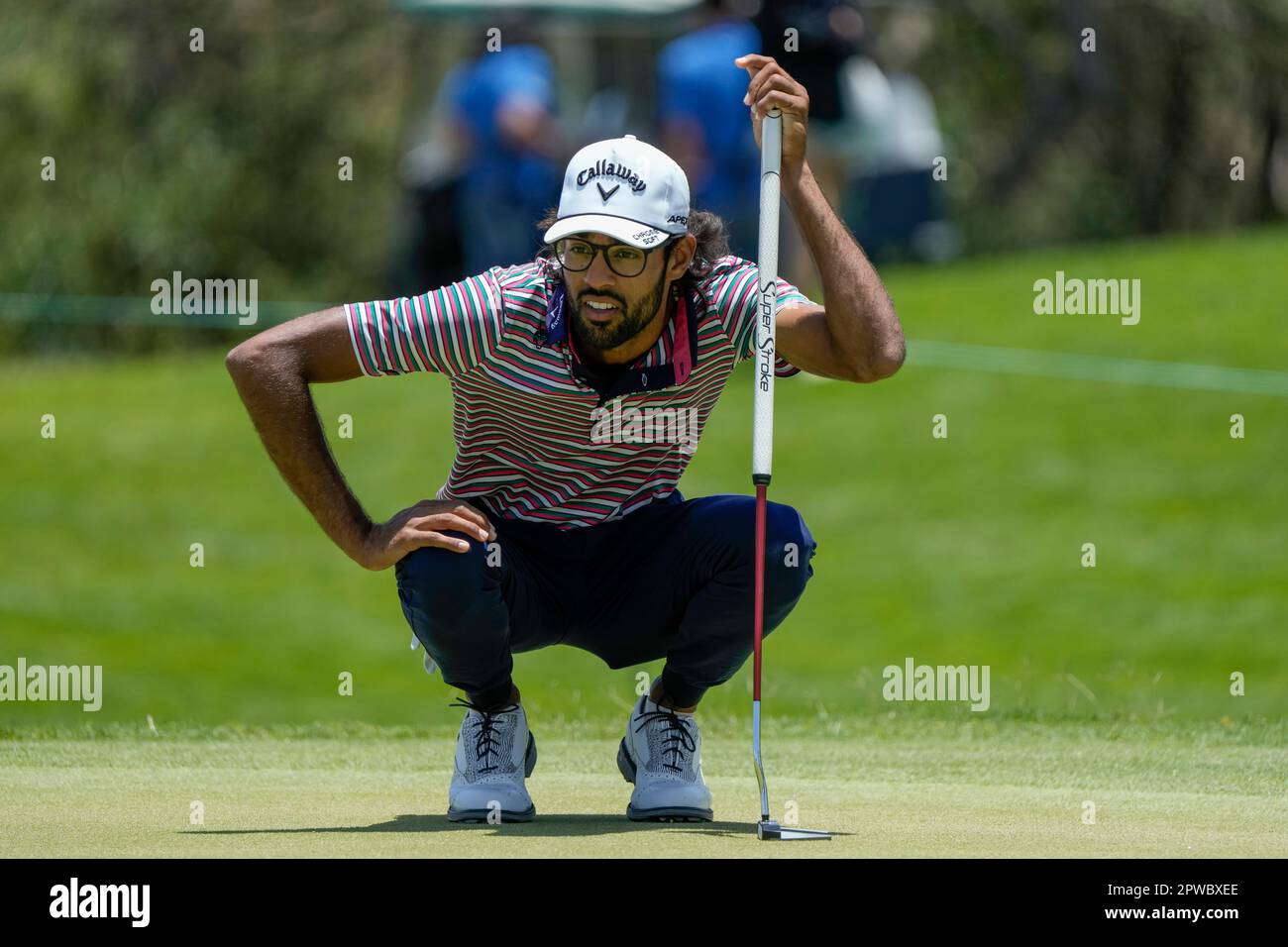 Akshay Bhatia, of the United States, prepares to putt on the 10th green ...