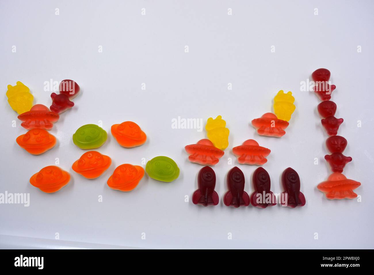 Sweets in the form of red, yellow aliens, cherry space rockets, green ...