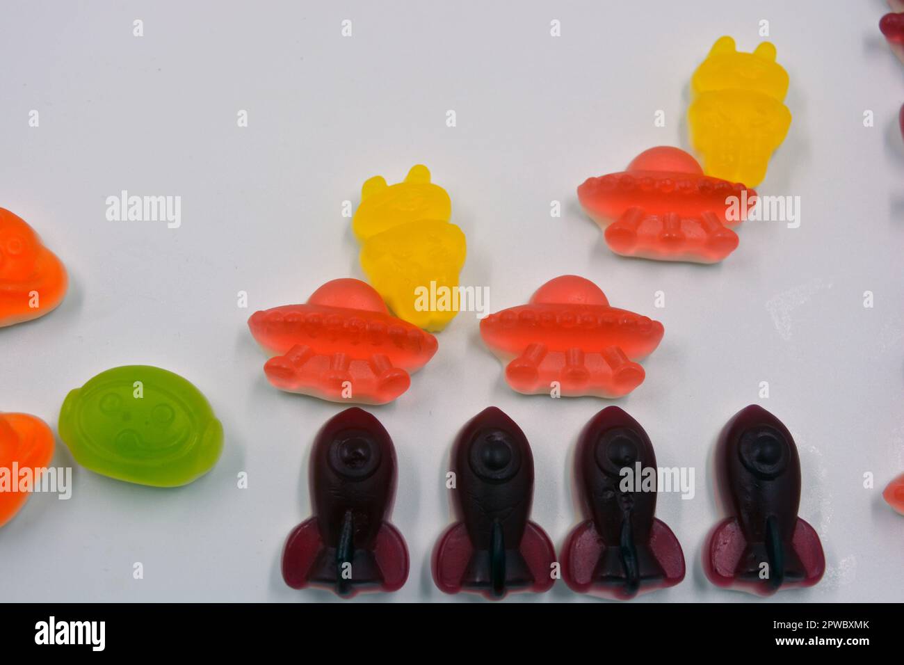 Sweets in the form of red, yellow aliens, cherry space rockets, green ...