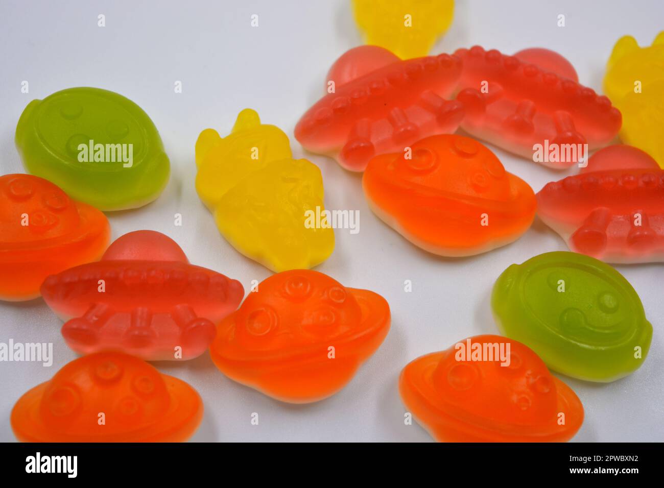 Sweets in the form of red, yellow aliens, cherry space rockets, green ...