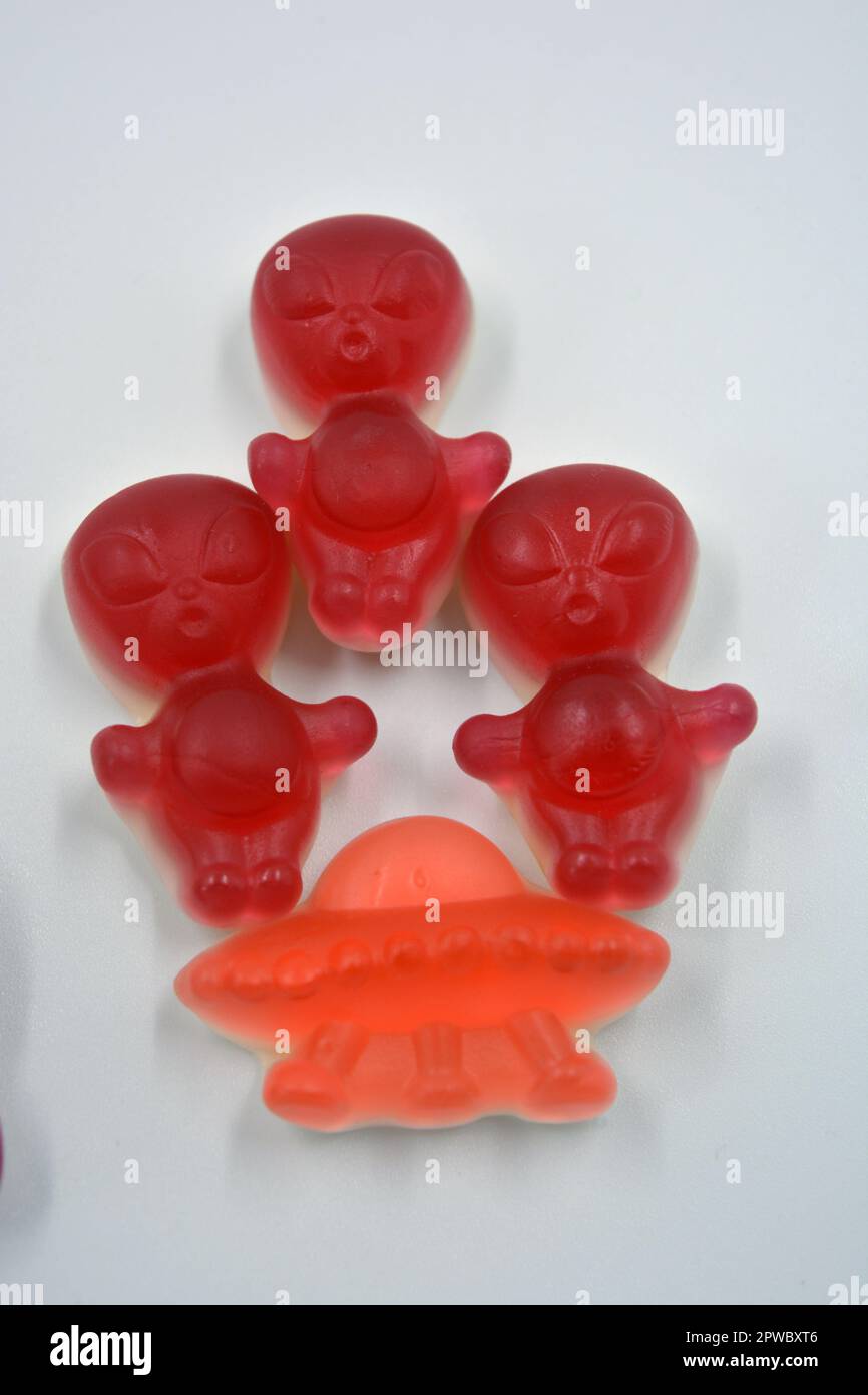 Sweets in the form of red, yellow aliens, cherry space rockets, green ...