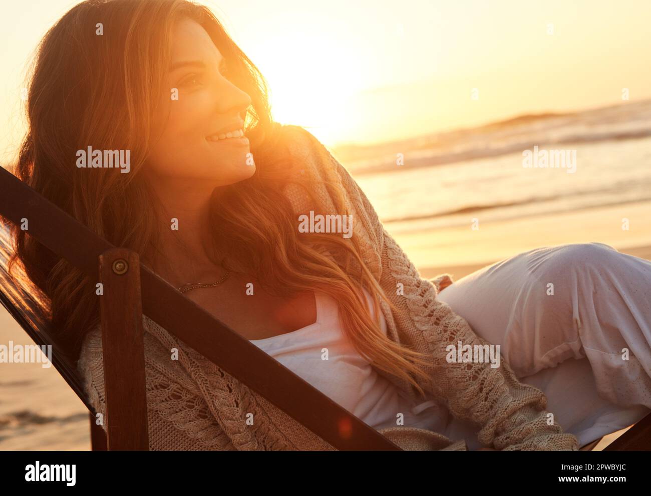 Happiness is all about being in a relaxed state of mind. a young woman ...