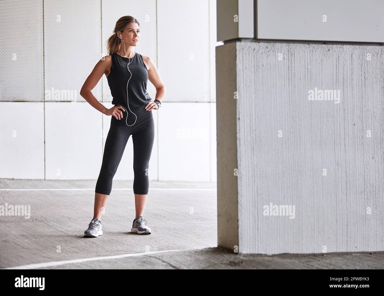 Keep pushing, keep persisting. a sporty young woman taking a break ...