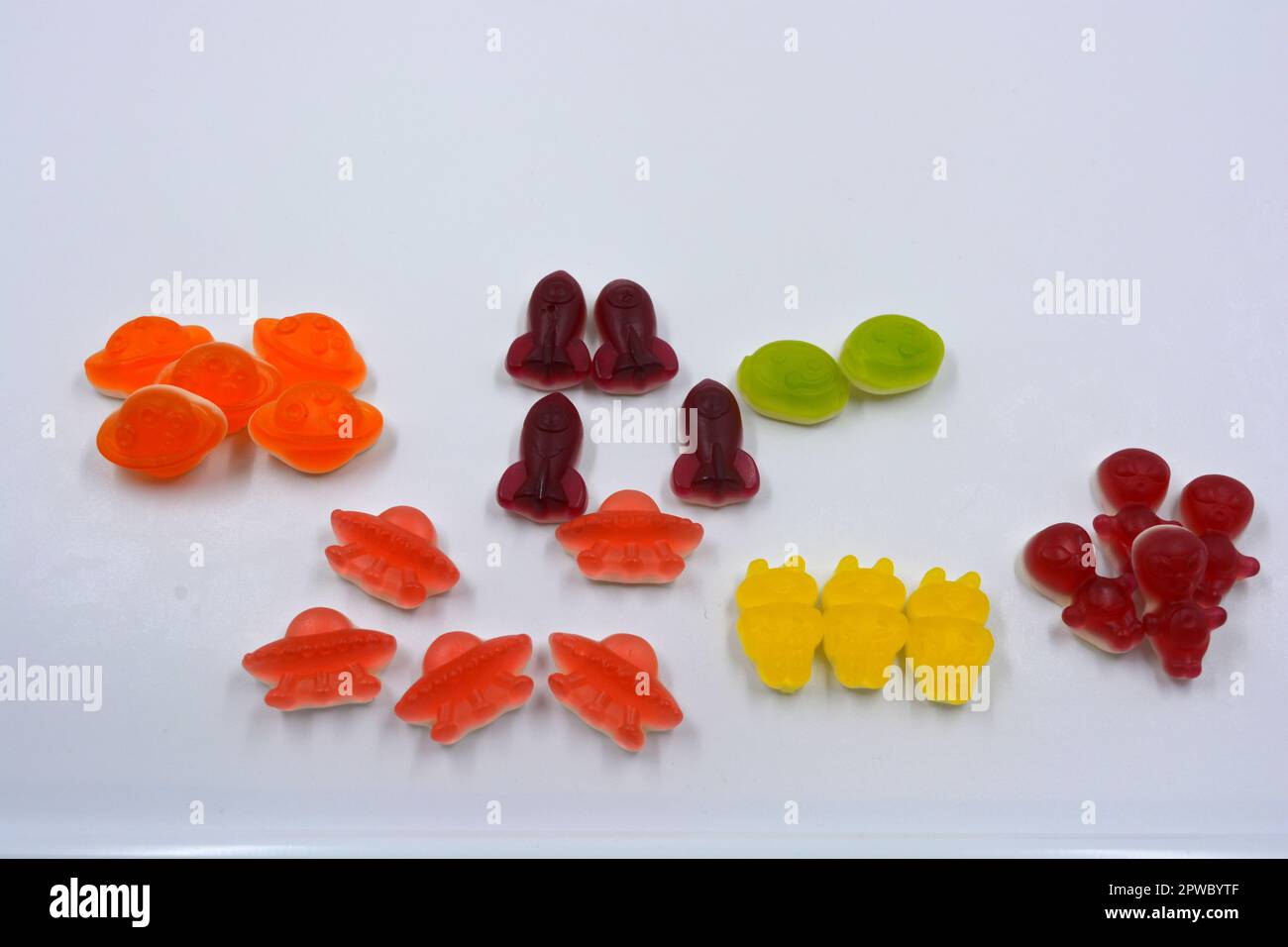 Sweets in the form of red, yellow aliens, cherry space rockets, green ...