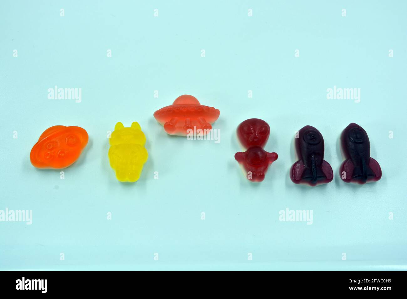 Sweets in the form of red, yellow aliens, cherry space rockets, green ...