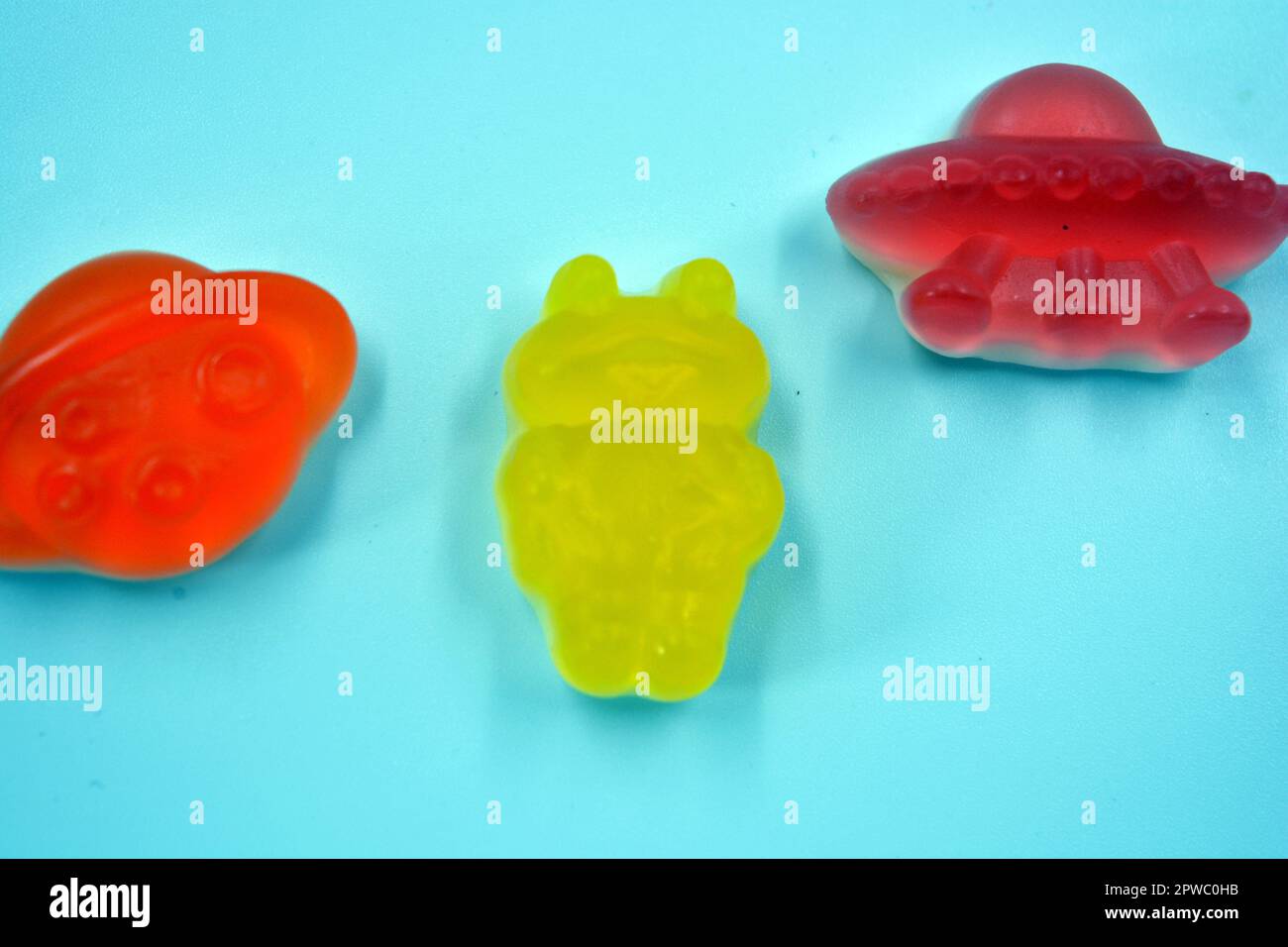 Sweets in the form of red, yellow aliens, cherry space rockets, green ...