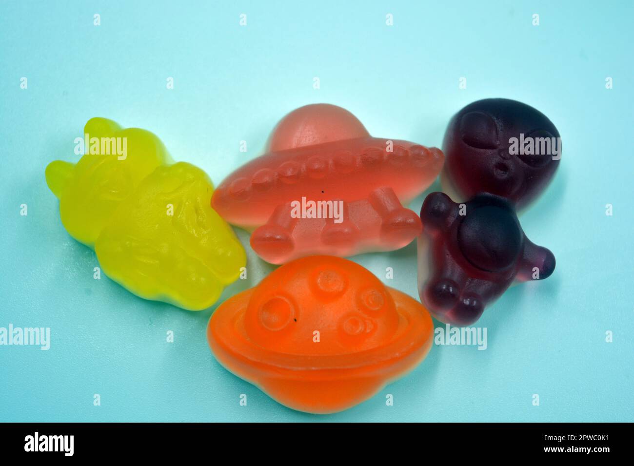 Sweets in the form of red, yellow aliens, cherry space rockets, green ...