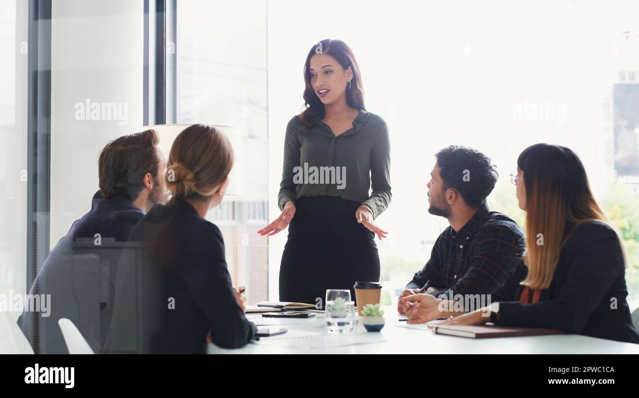 Settling any misunderstandings to their new plan. a young businesswoman ...