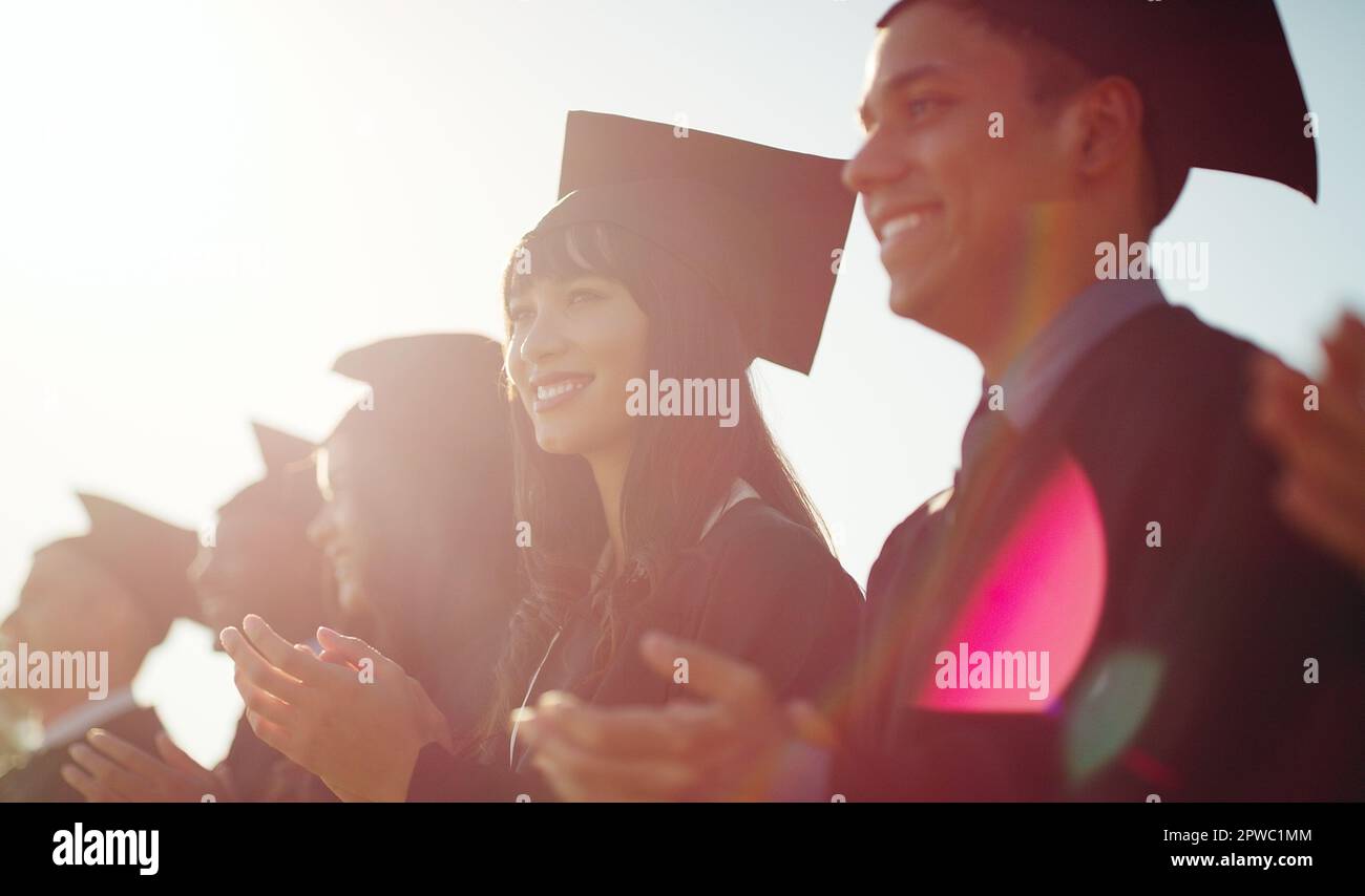 You all deserve a round of applause. a group of cheerful young students ...