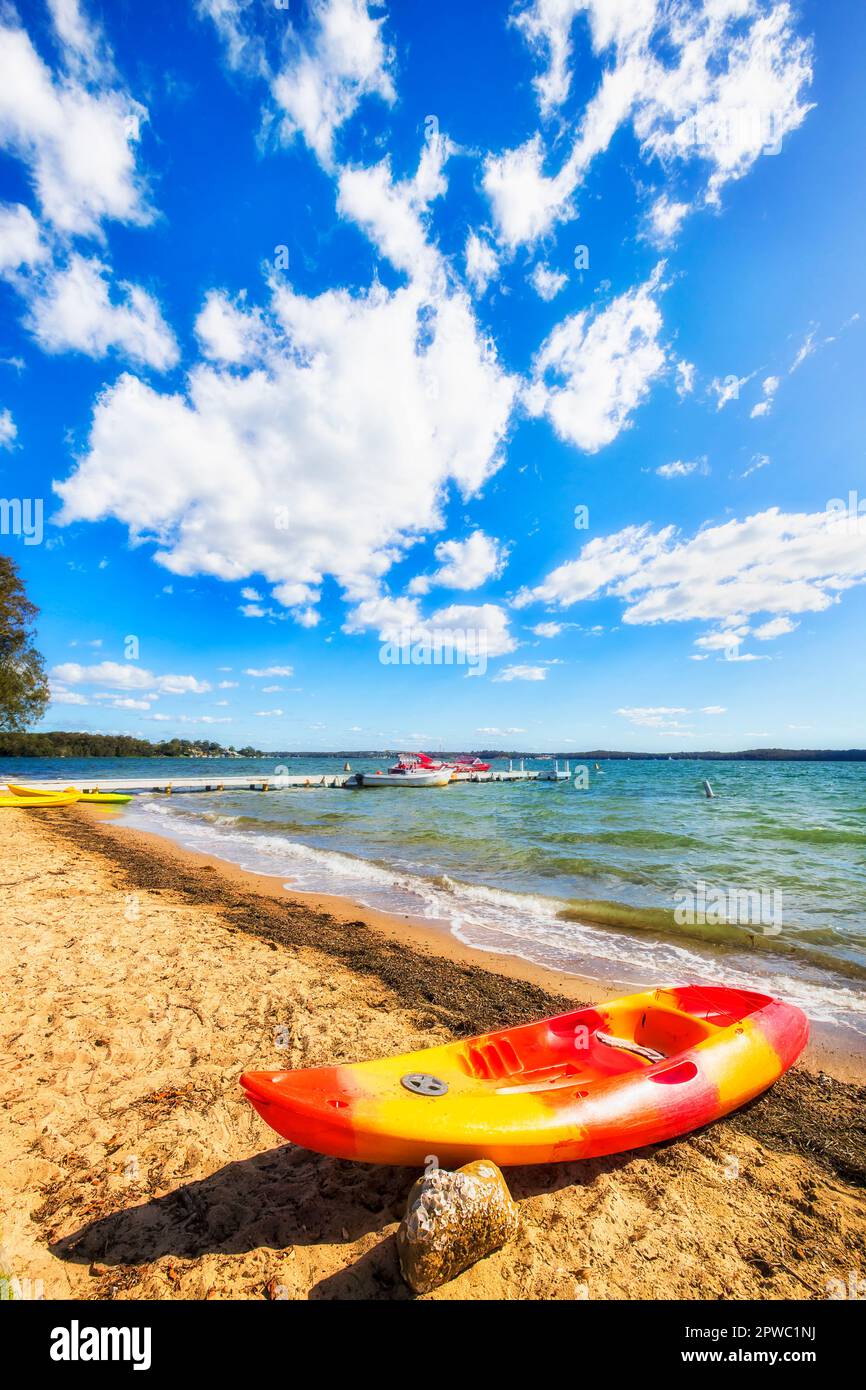 Small floating kayak on sandy beach of Murrays beach shore town at Lake ...