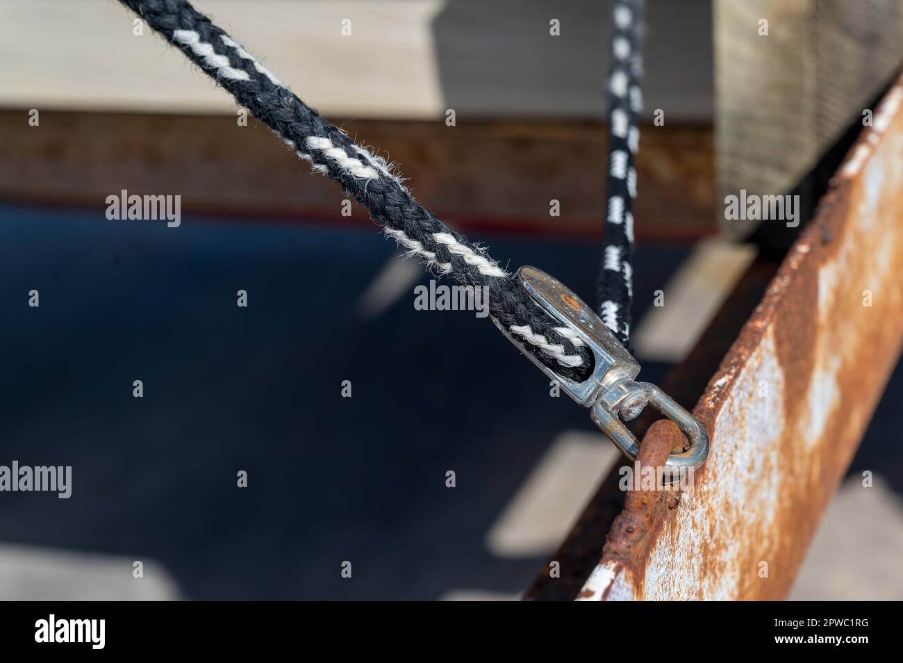 Small block and tackle under tension being used to control the movement ...