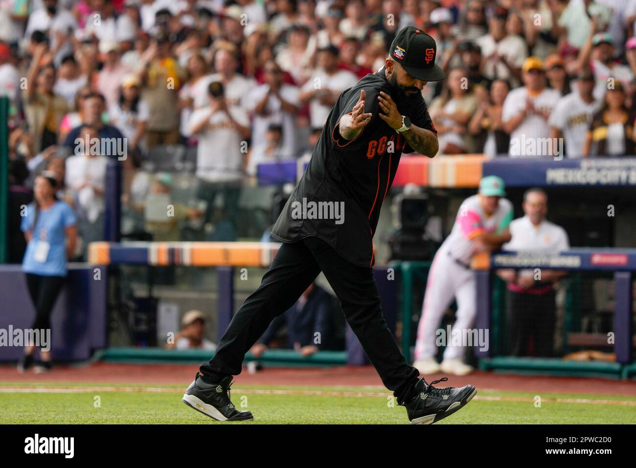 Former player Sergio Romo gestures after throwing out the ceremonial ...