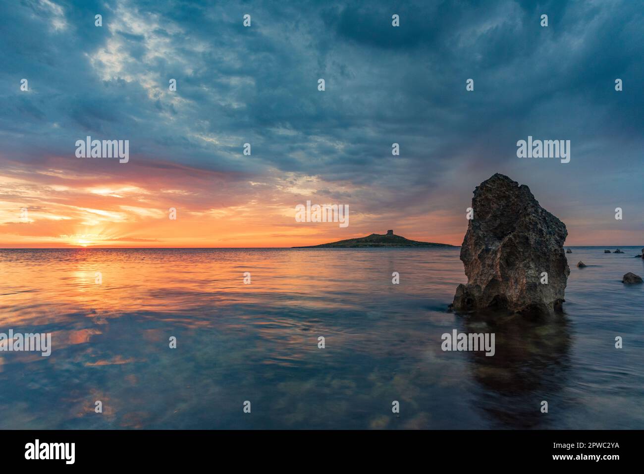 Sun setting behind the islet of Isola delle Femmine, Sicily Stock Photo ...