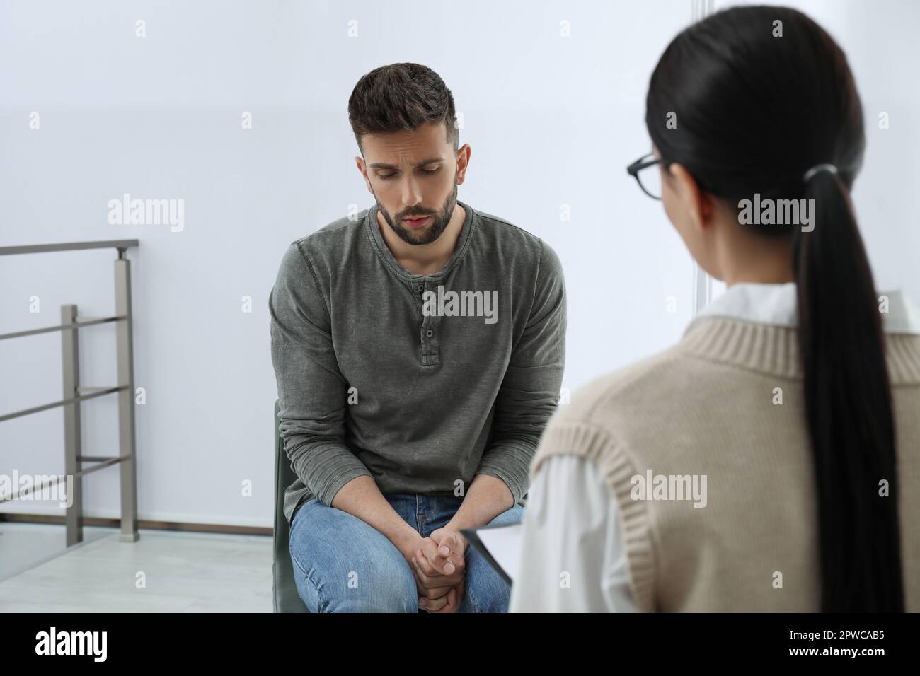 Psychotherapist working with drug addicted man indoors Stock Photo - Alamy