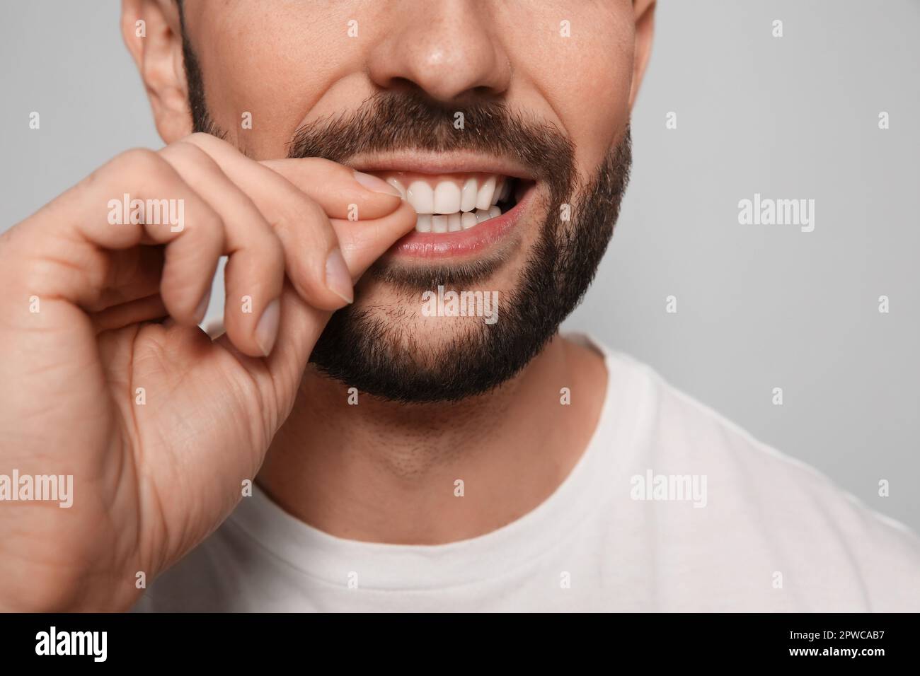 Man biting nails hi-res stock photography and images - Alamy