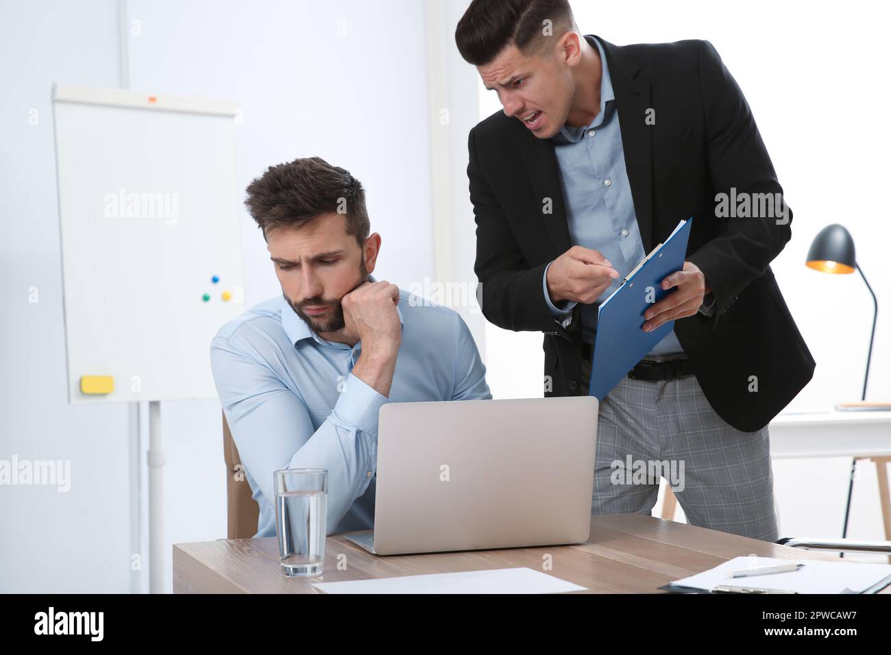 Boss screaming at employee in office. Toxic work environment Stock ...