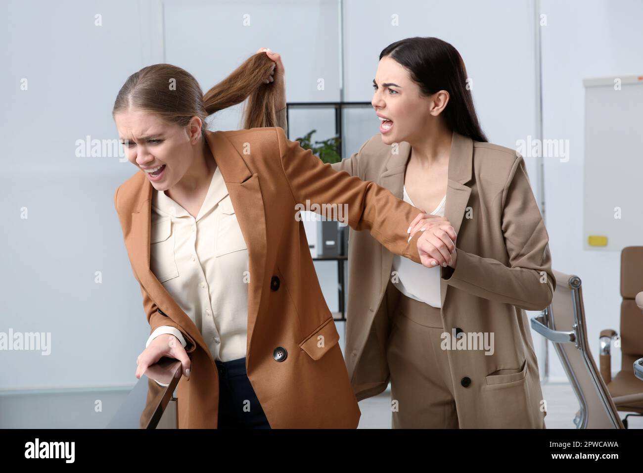 Emotional colleagues fighting in office. Workplace conflict Stock Photo ...