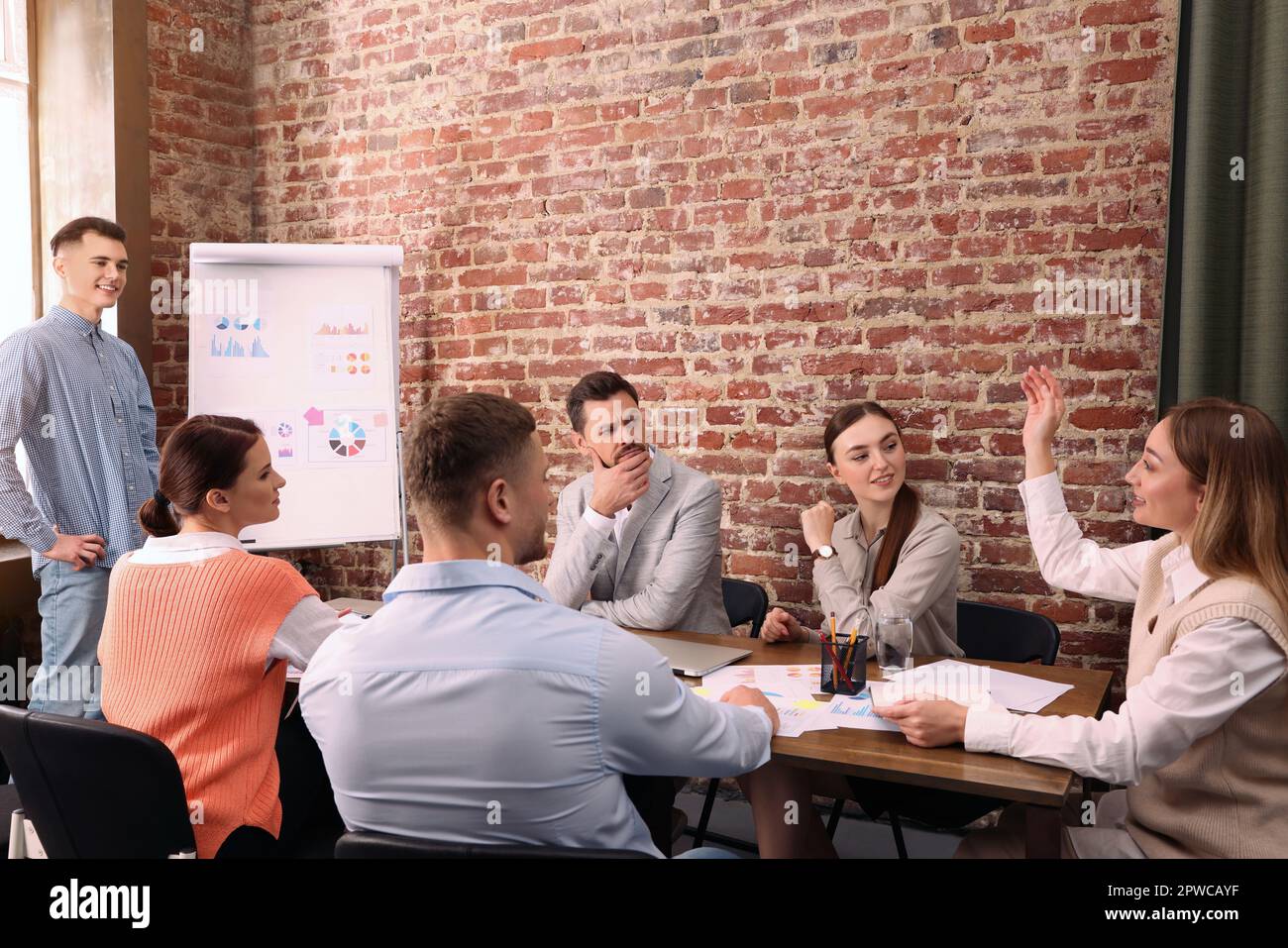 Employees having meeting in office. Team work Stock Photo - Alamy