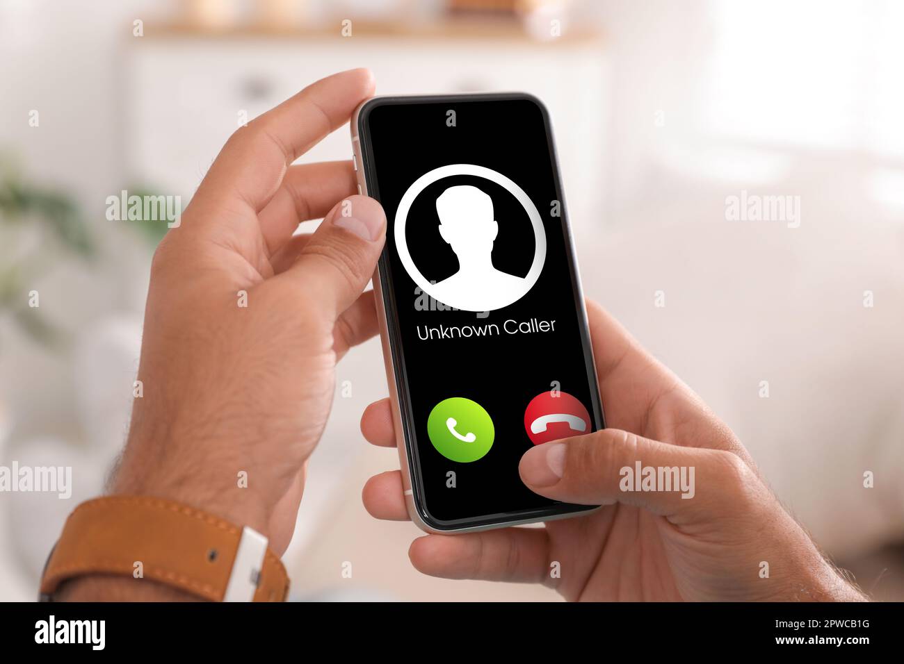 Man declining incoming call from unknown caller indoors, closeup. Be ...
