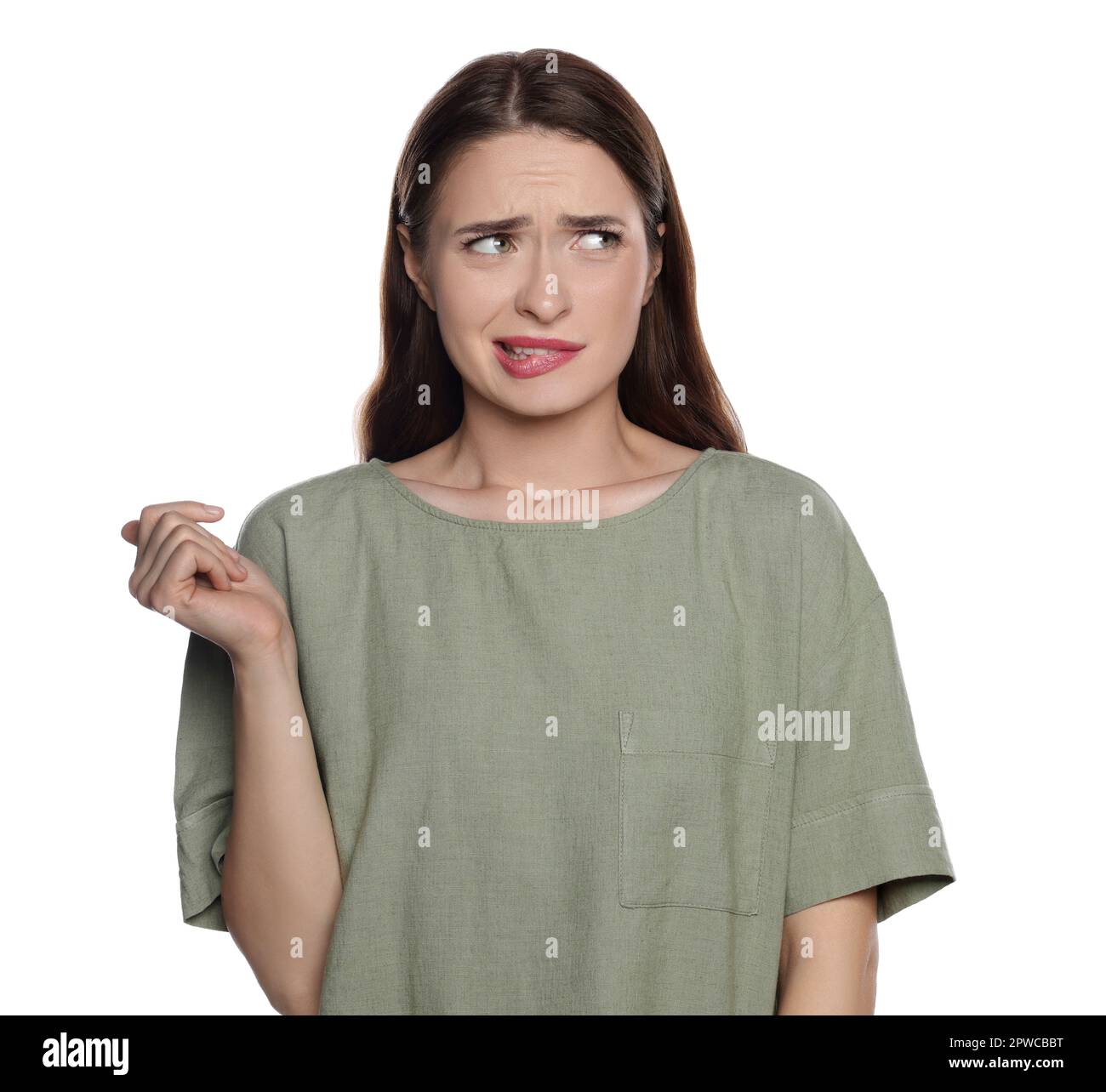Embarrassed young woman in shirt on white background Stock Photo - Alamy