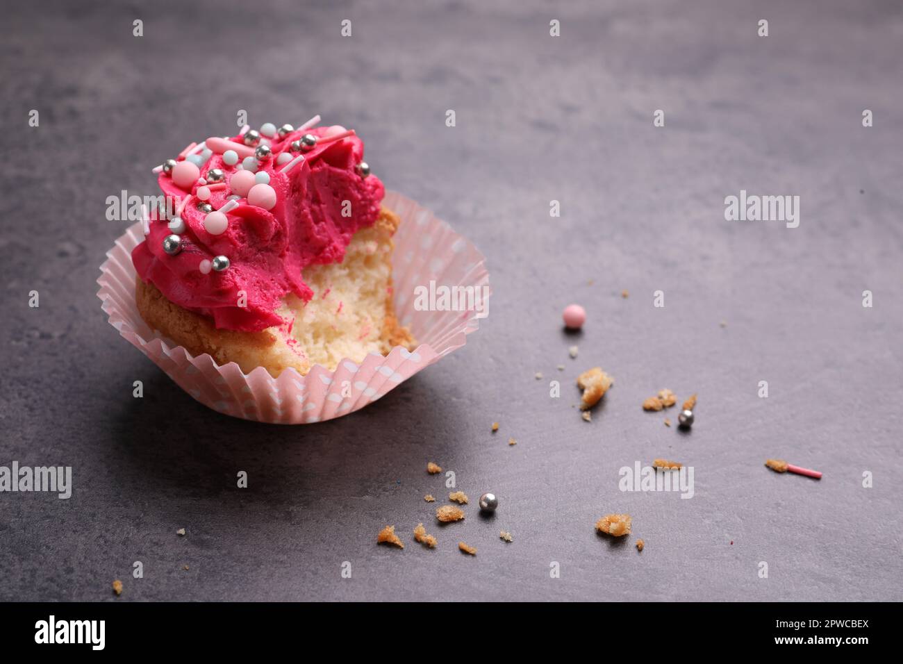 Failed cupcake with cream on grey table. Troubles happen Stock Photo ...