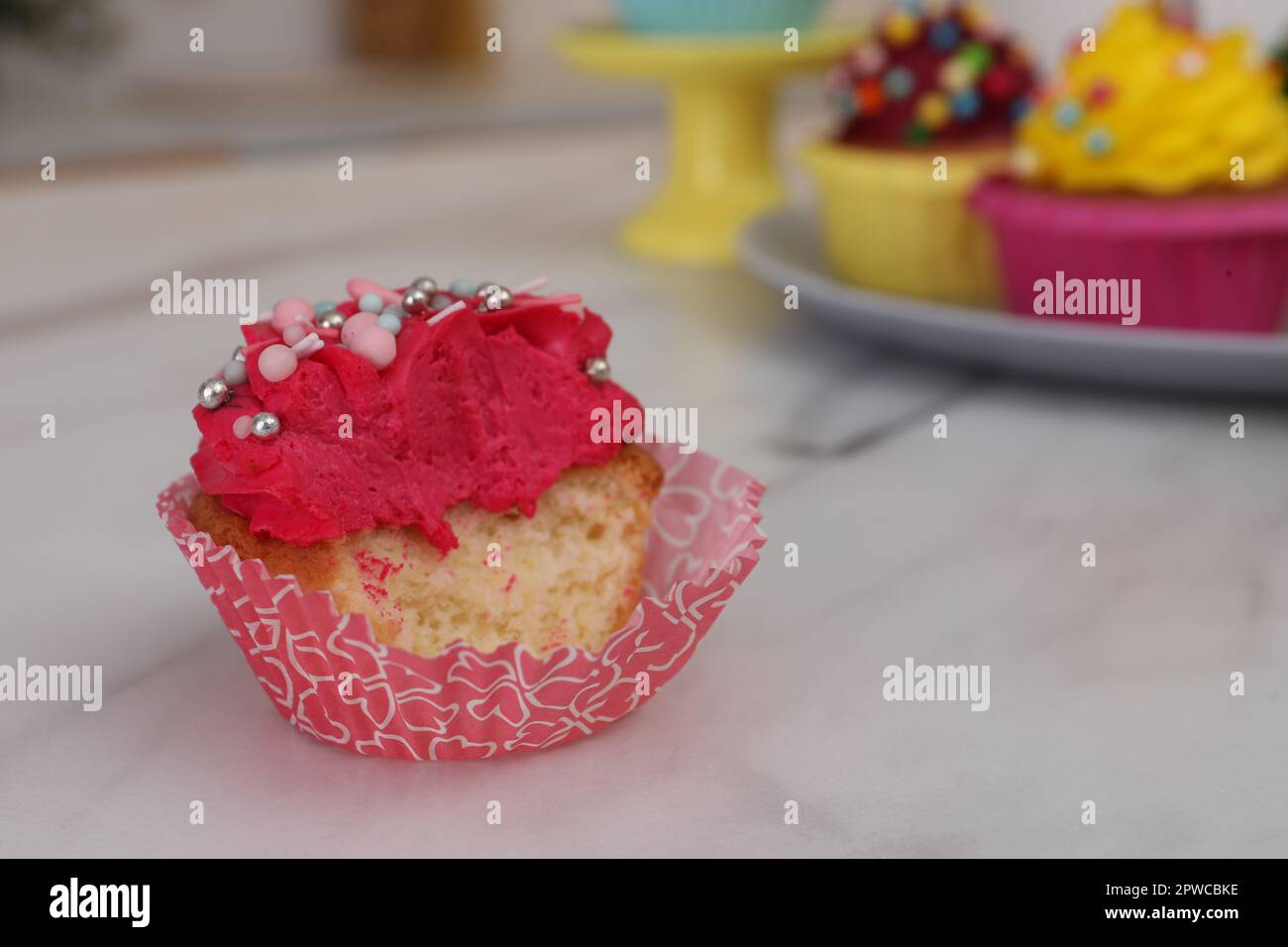 Failed cupcake with cream on light table. Troubles happen Stock Photo ...