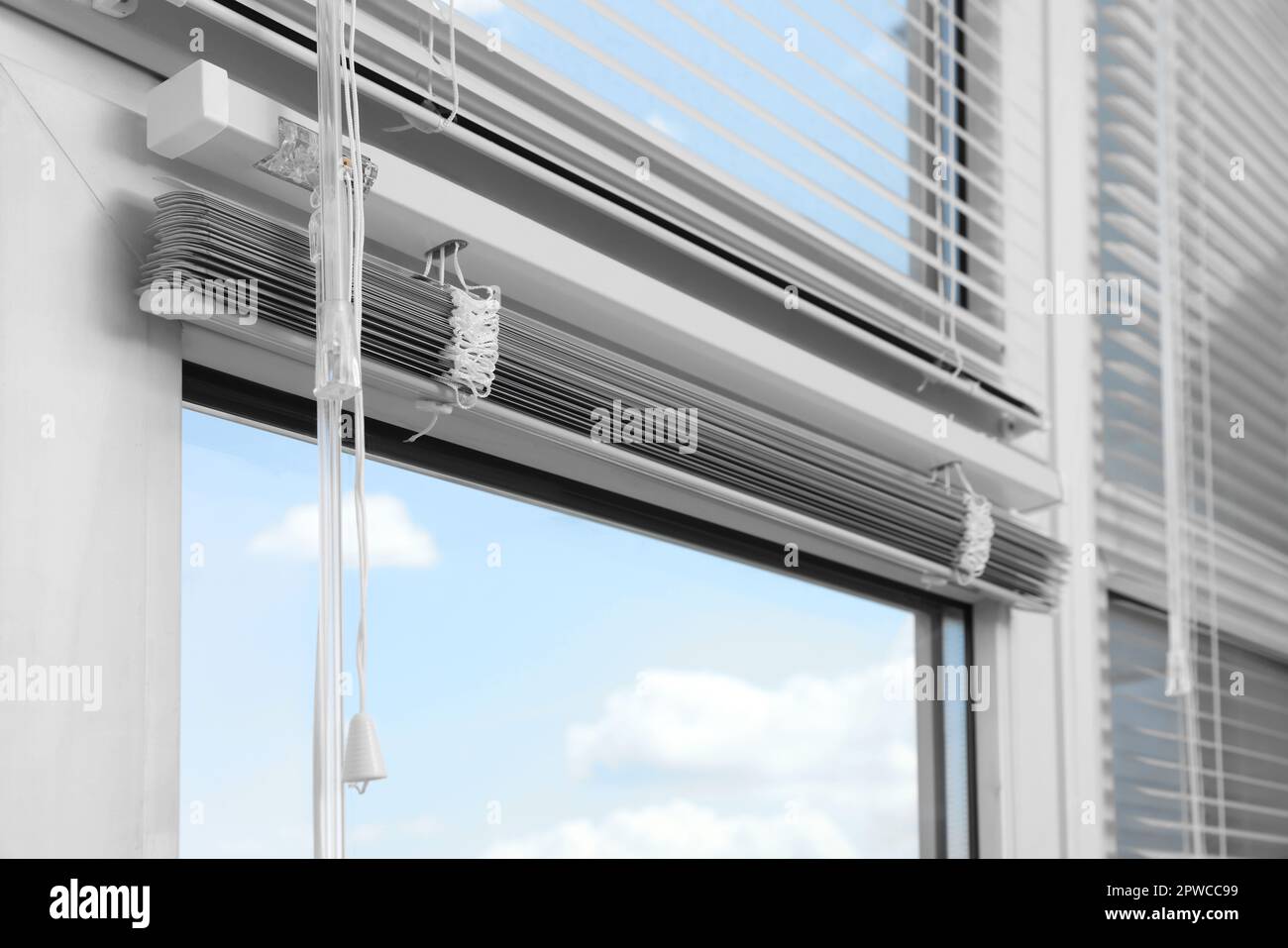 Window with horizontal blinds and control system indoors, closeup Stock ...