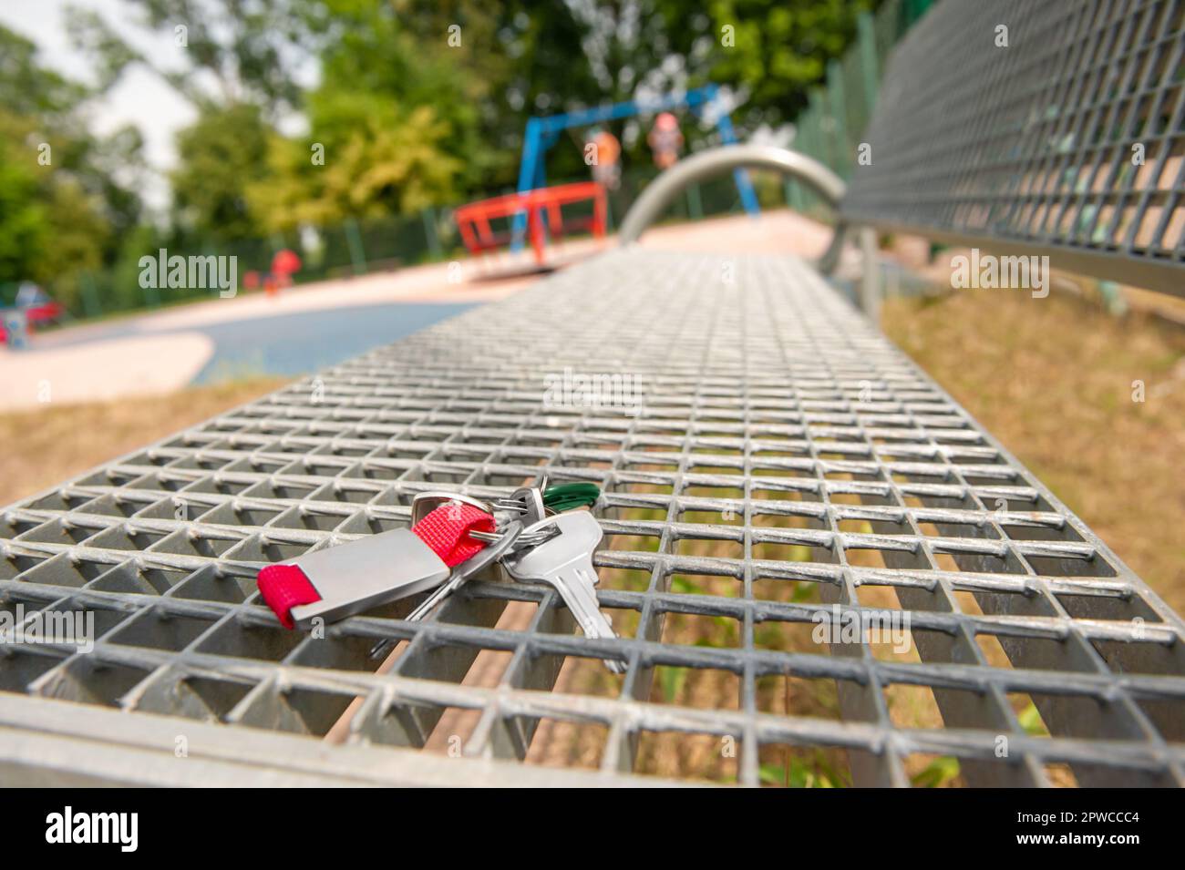 Keys forgotten on metal bench outdoors. Lost and found Stock Photo - Alamy