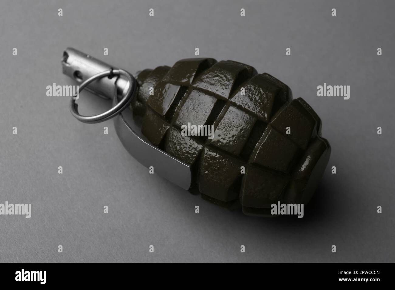 Hand grenade on grey background, closeup. Explosive weapon Stock Photo ...