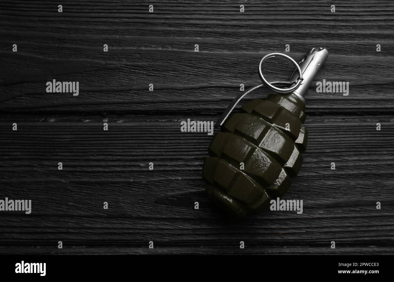 Hand grenade on black wooden table, top view. Space for text Stock ...