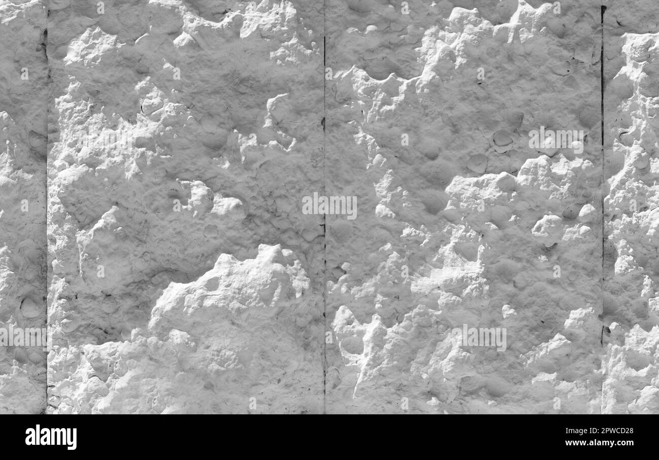 White rough stone wall as background, closeup Stock Photo - Alamy