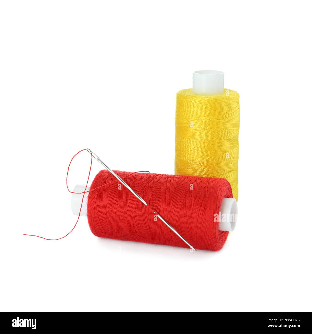Different colorful sewing threads and needle on white background Stock ...