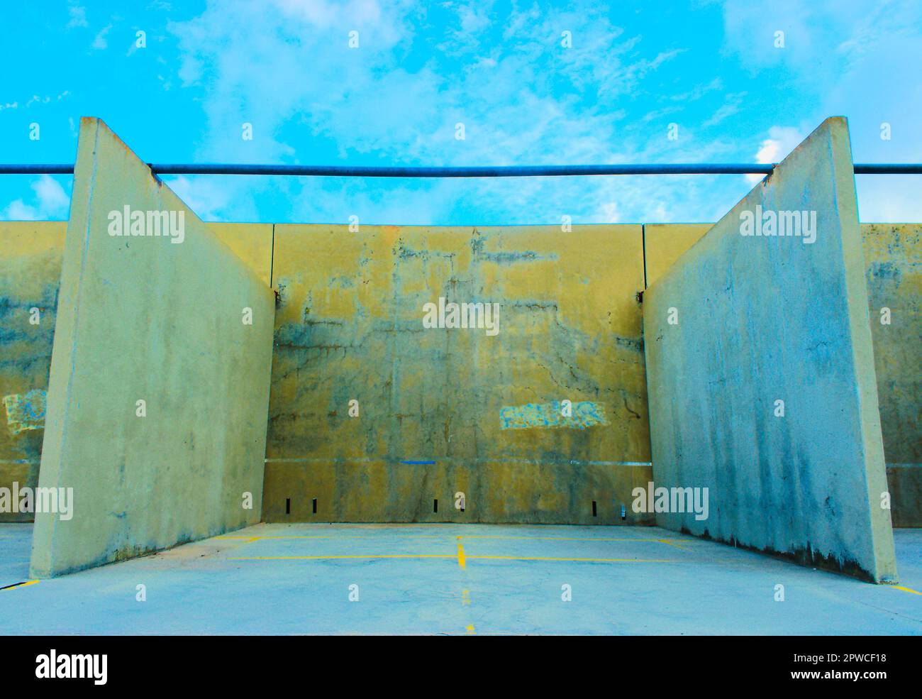 Outdoor handball court under a bright blue sky that might be seen in a ...