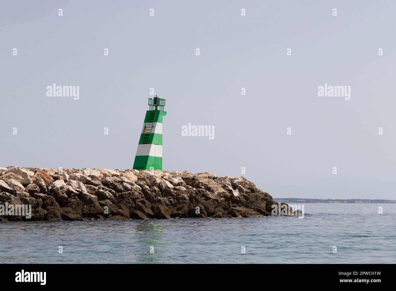 Marker on a groyne at the harbour entrance in the port of Lagos, Faro ...