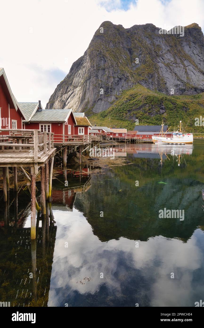 Traditional red rorbuer cabins in the fishing village of Reine, Lofoten ...