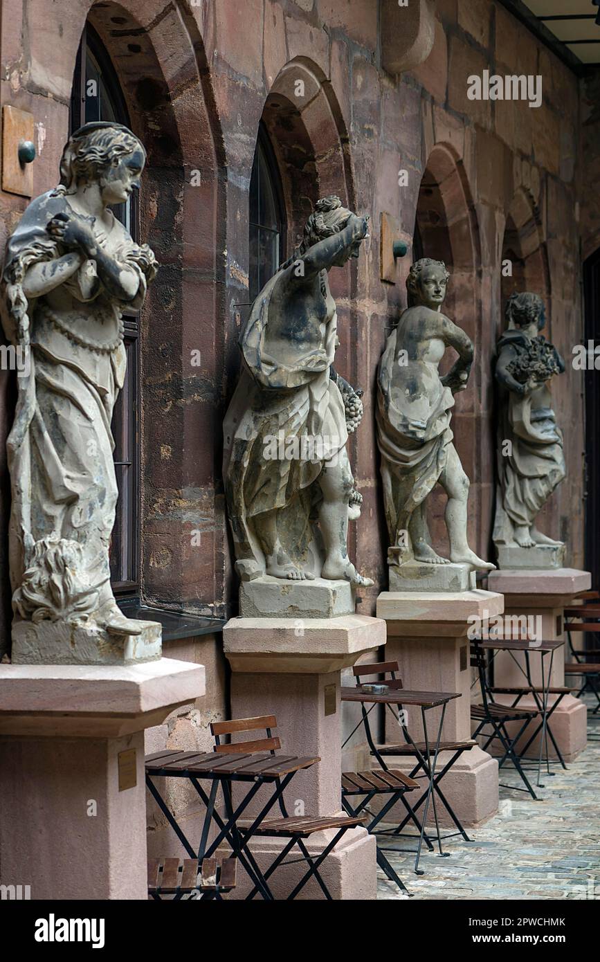 Statues of the four seasons from the 18th century in the courtyard of ...