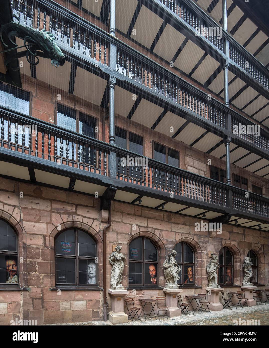 Historic courtyard with galleries and sculptures of the four seasons ...
