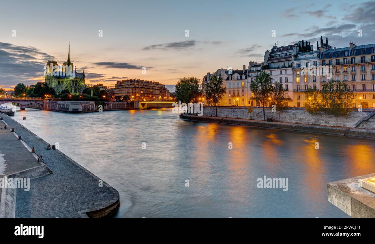 Beautiful evening on the Seine in Paris with Notre Dame Cathedral in ...