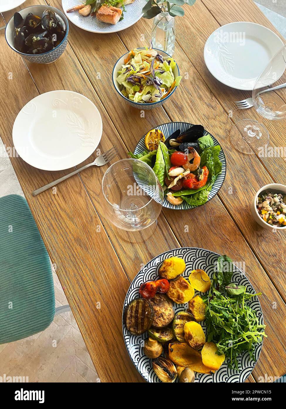 Table set for small dinner party at home or restaurant. Overhead shot ...