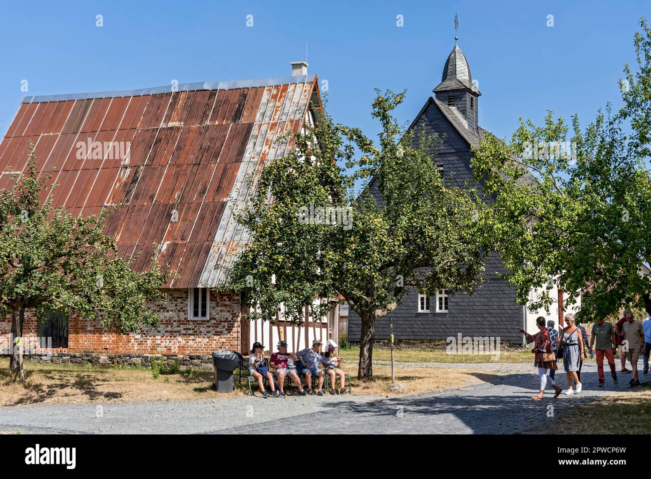 People in front of historic half-timbered houses from Mademuehlen and ...