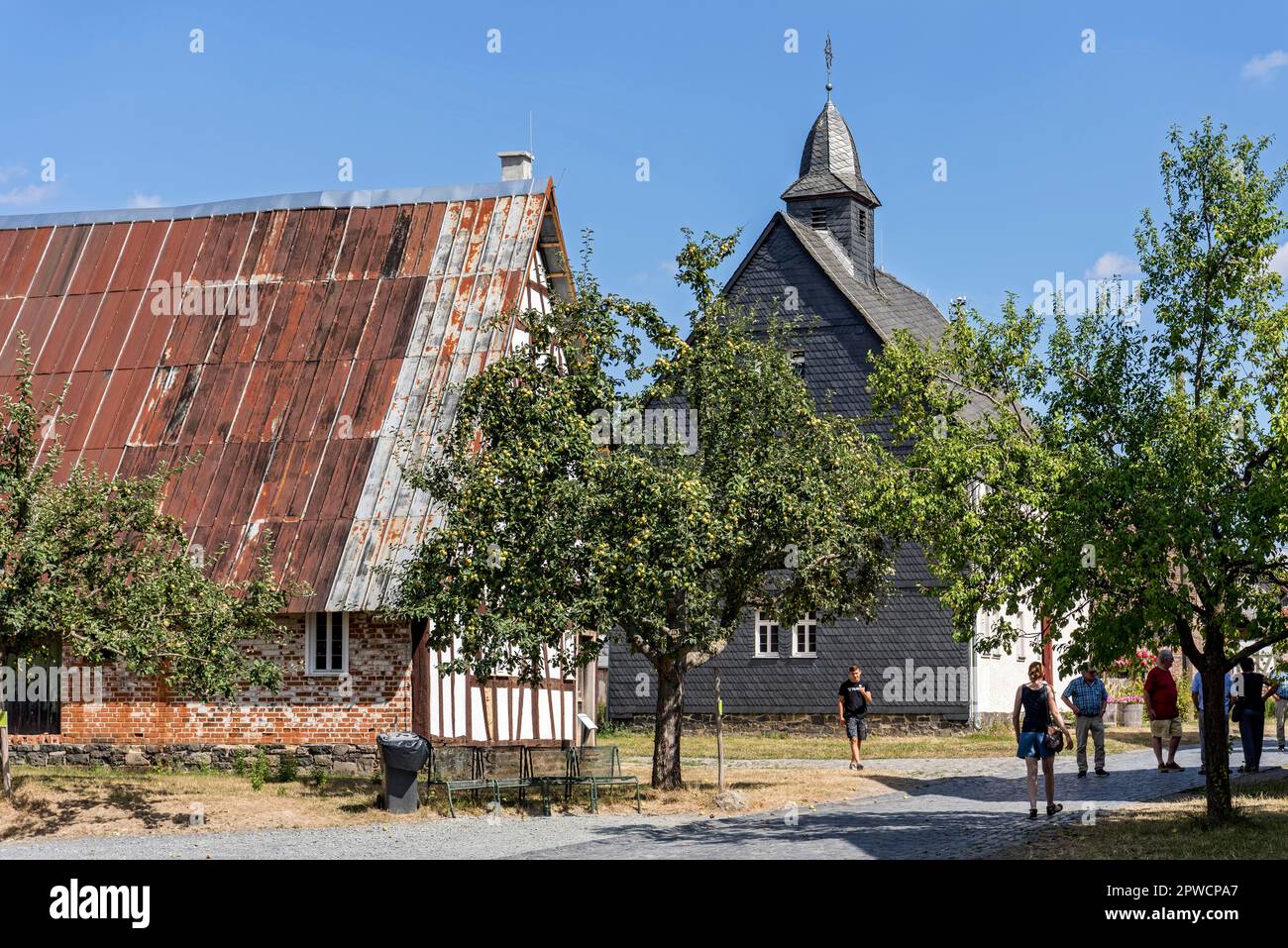 People in front of historic half-timbered houses from Mademuehlen and ...