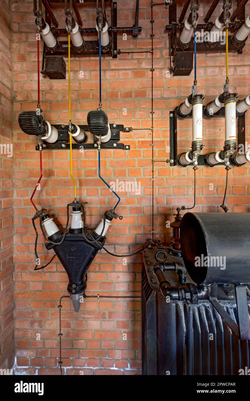 Obsolete electrical lines over transformer in transformer house ...