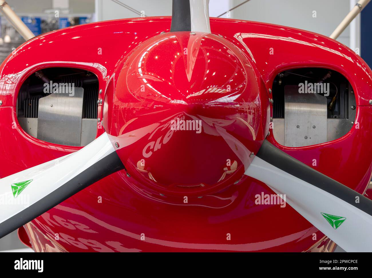 The front part of the aircraft with the propeller with red engine ...