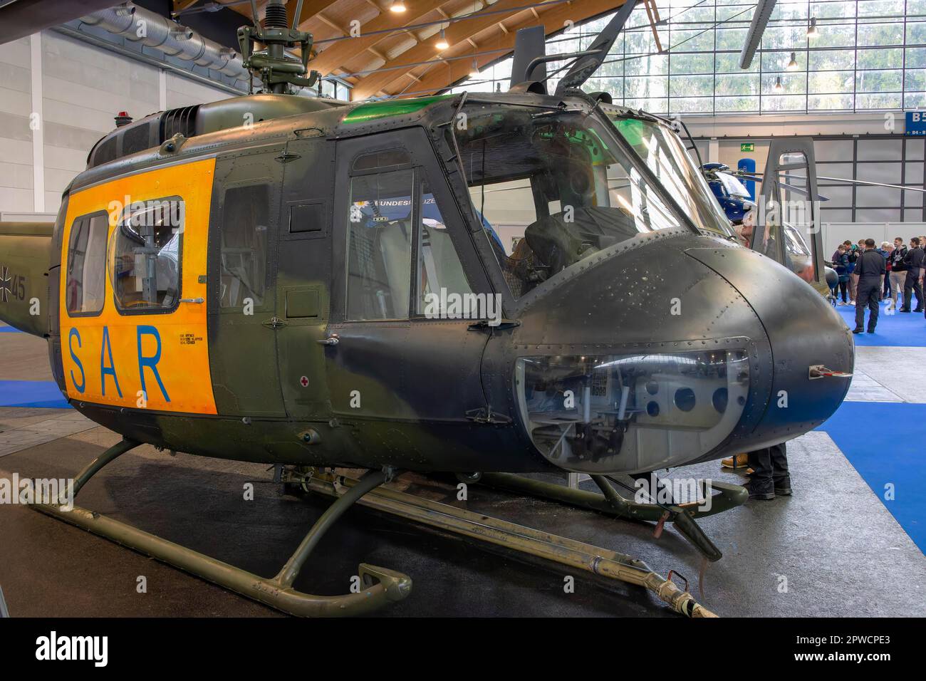 Detail of a Bundeswehr SAR helicopter with cockpit and orange doors ...