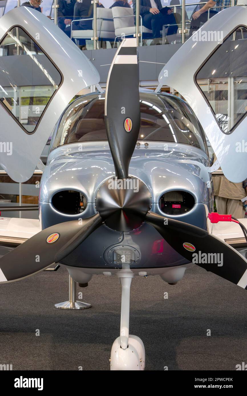 The front part of the aircraft with the propeller, with silver engine ...