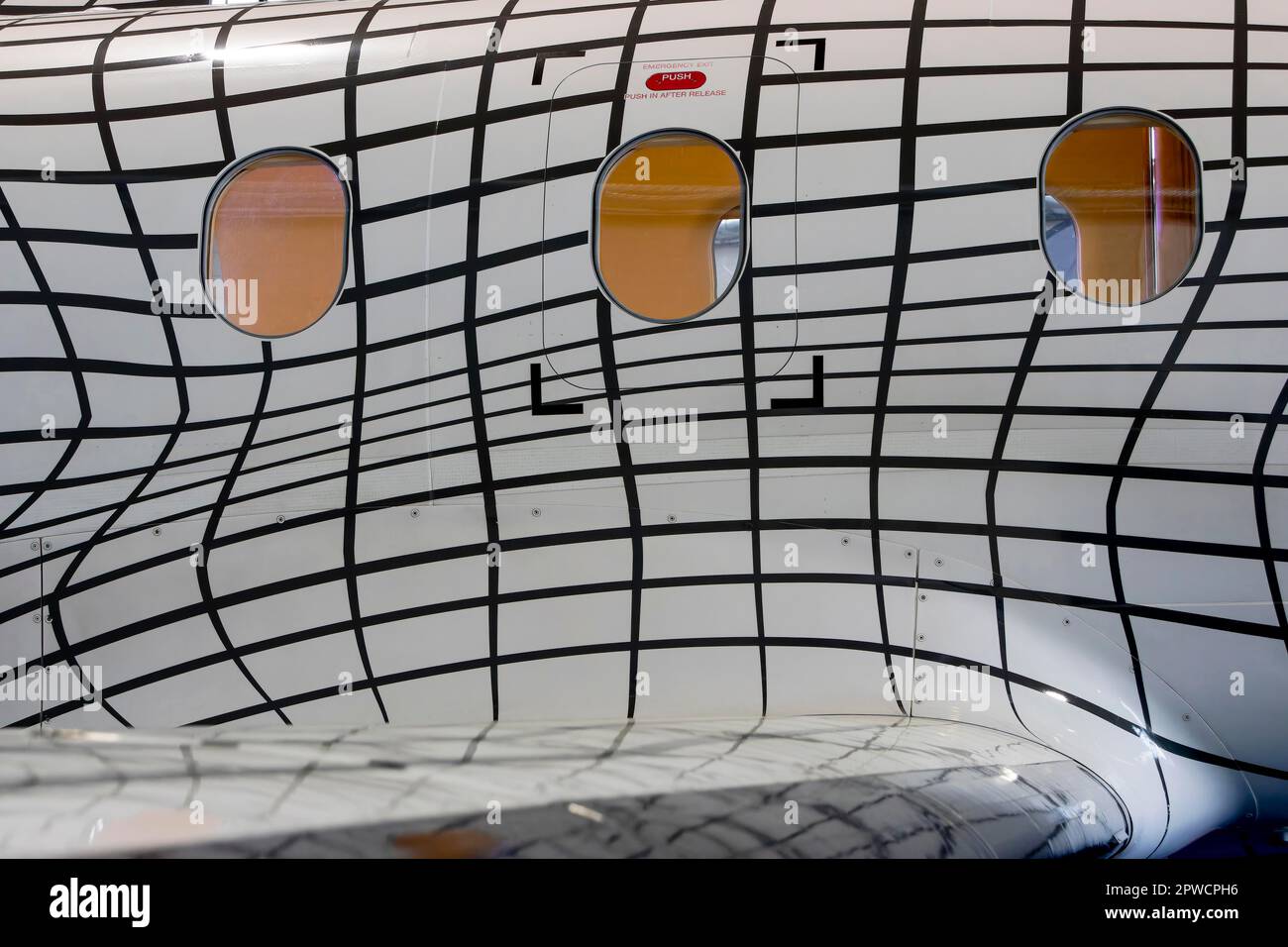 The windows of the cabin of a passenger aircraft, painted white with ...