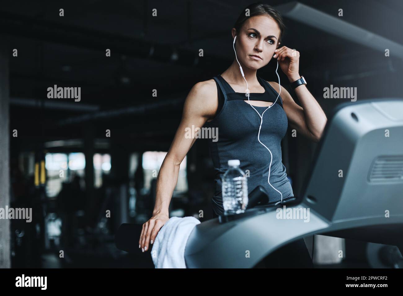 Turn up the volume, turn up the sweat. an attractive young woman ...