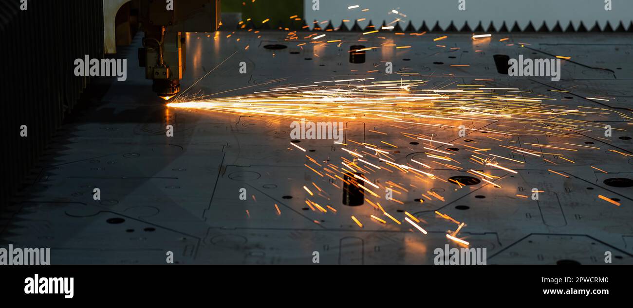 CNC machine. Laser cutting of metal. Sparks Stock Photo - Alamy